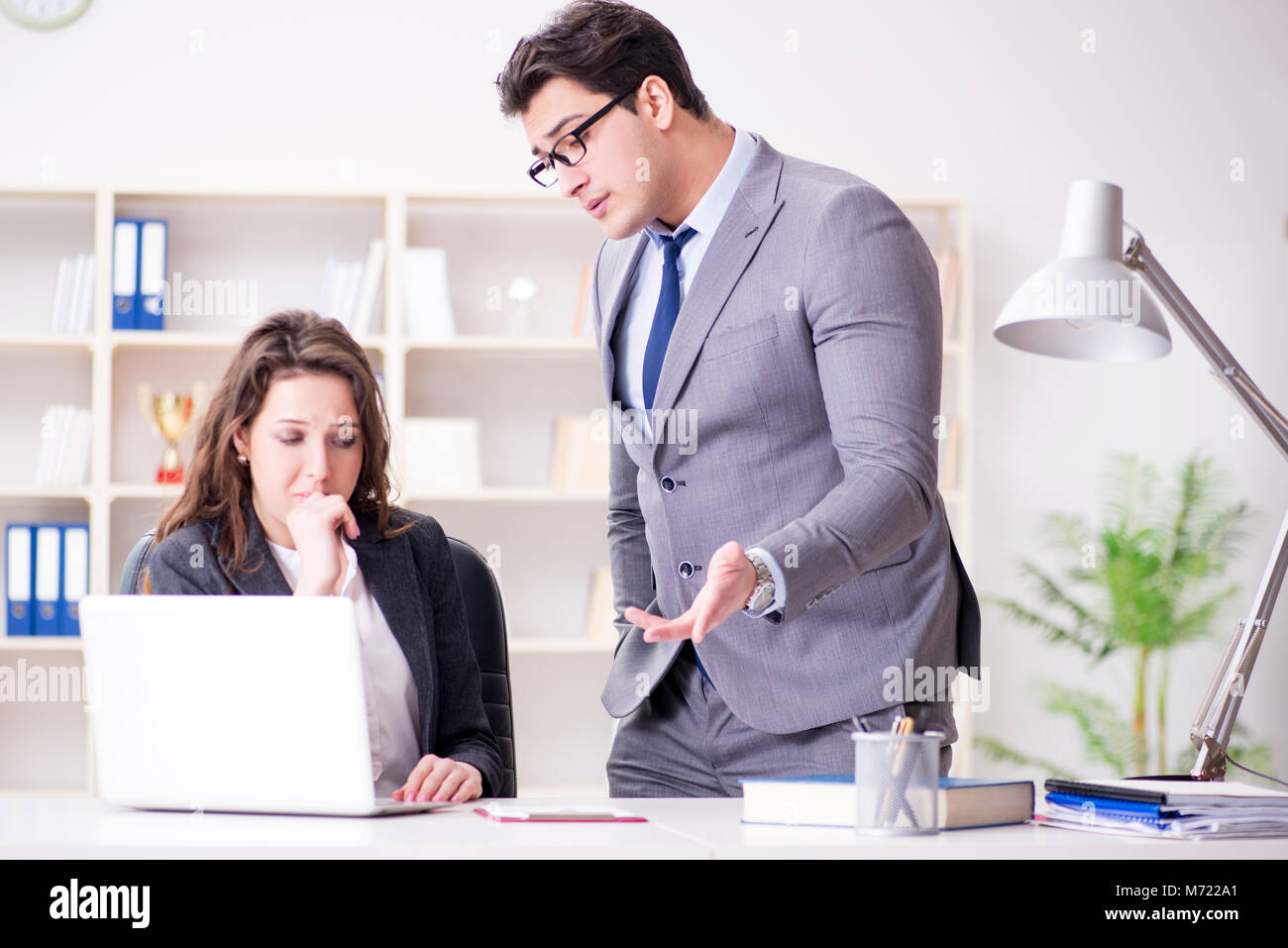 Angry boss unhappy with female employee performance Stock Photo - Alamy