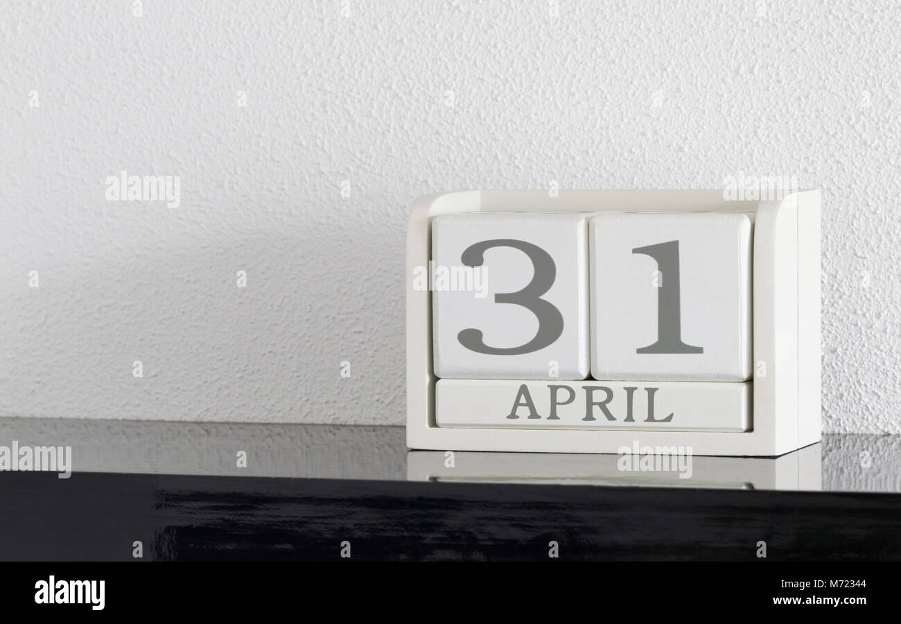 White block calendar present date 31 and month April on white wall ...