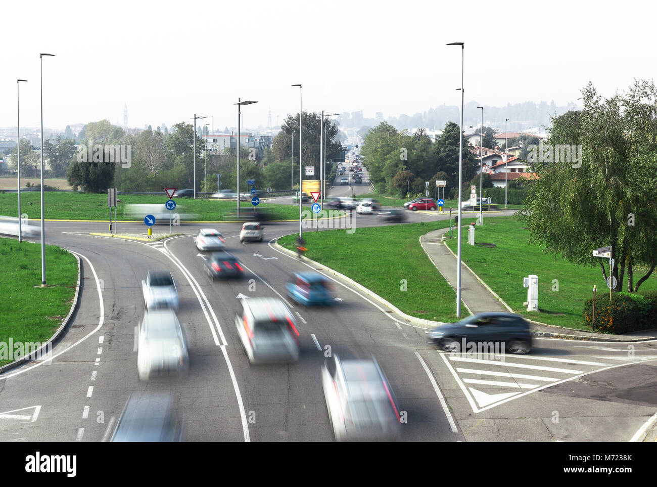 Road traffic at roundabout junction Stock Photo - Alamy