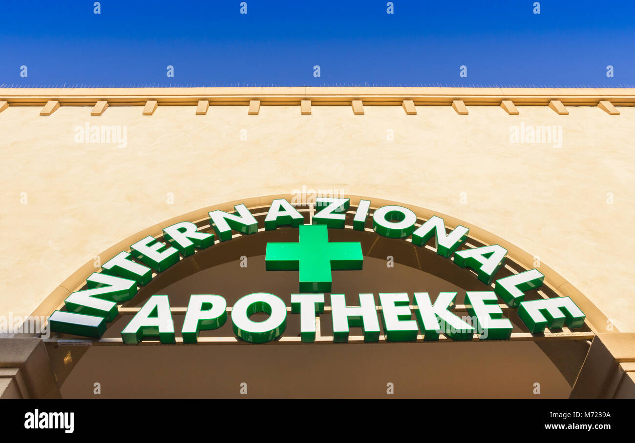 Italian Pharmacy Sign and Shop. Pharmacy sign in German language. Green ...