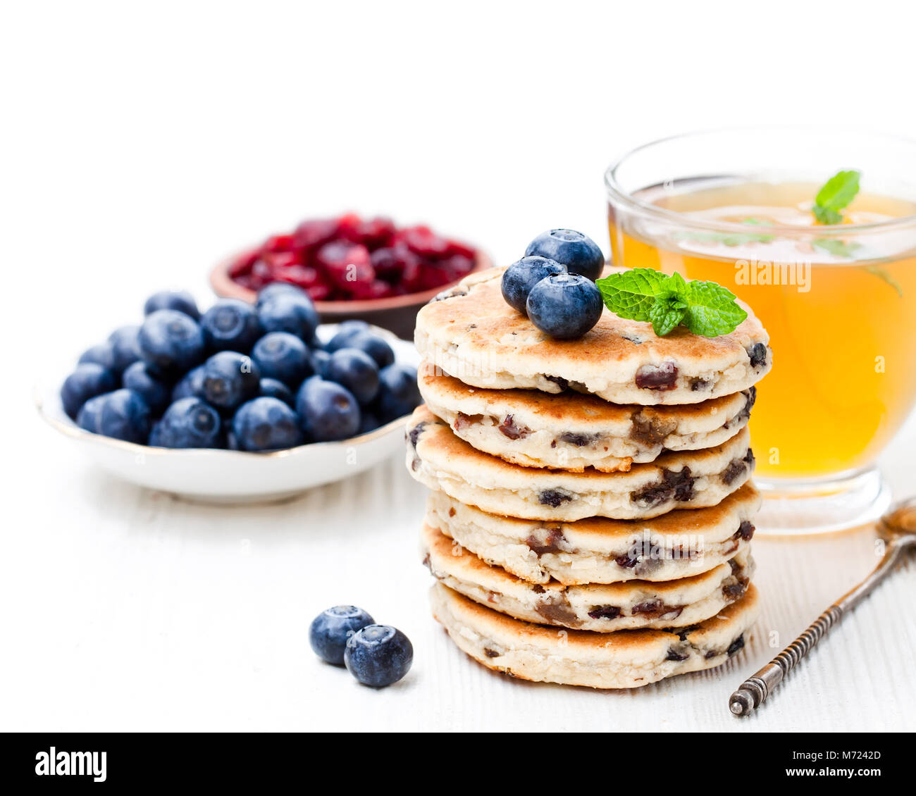 Stack of welsh cakes with blueberry and a cup of green tea Stock Photo ...