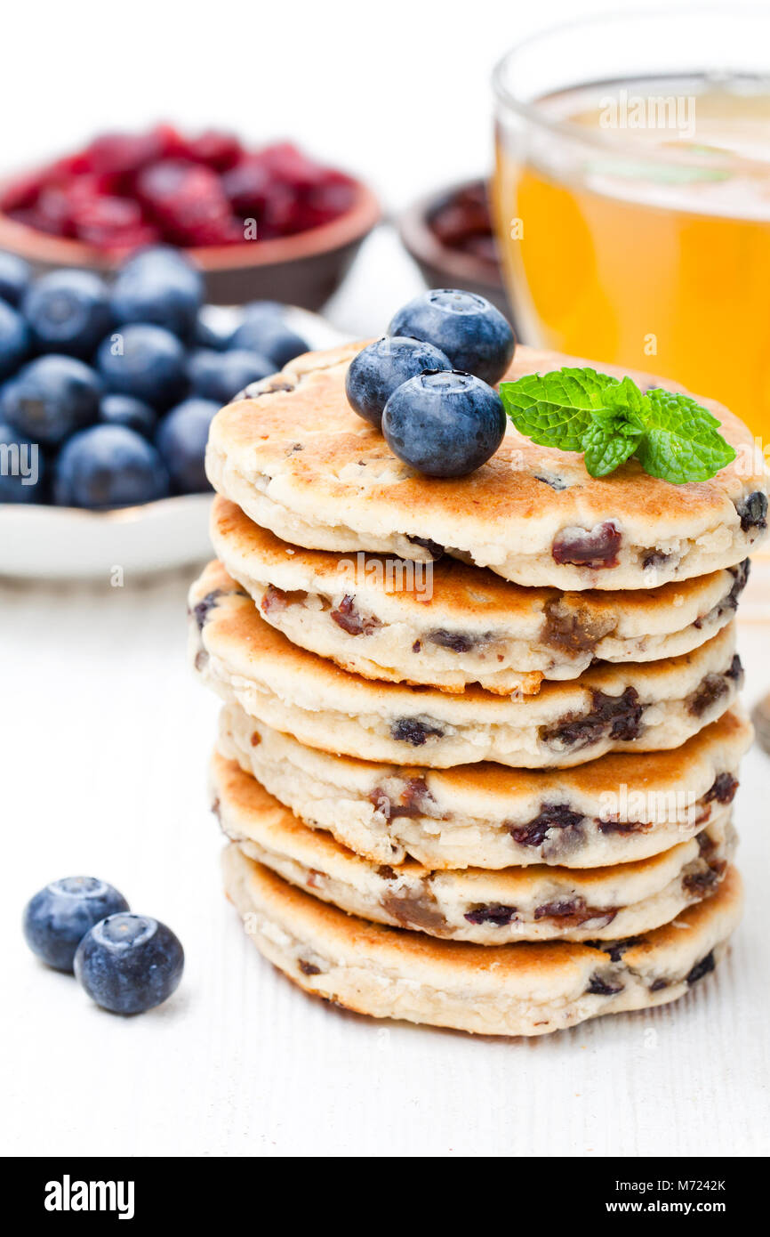 Stack of welsh cakes with blueberry and a cup of green tea Stock Photo ...