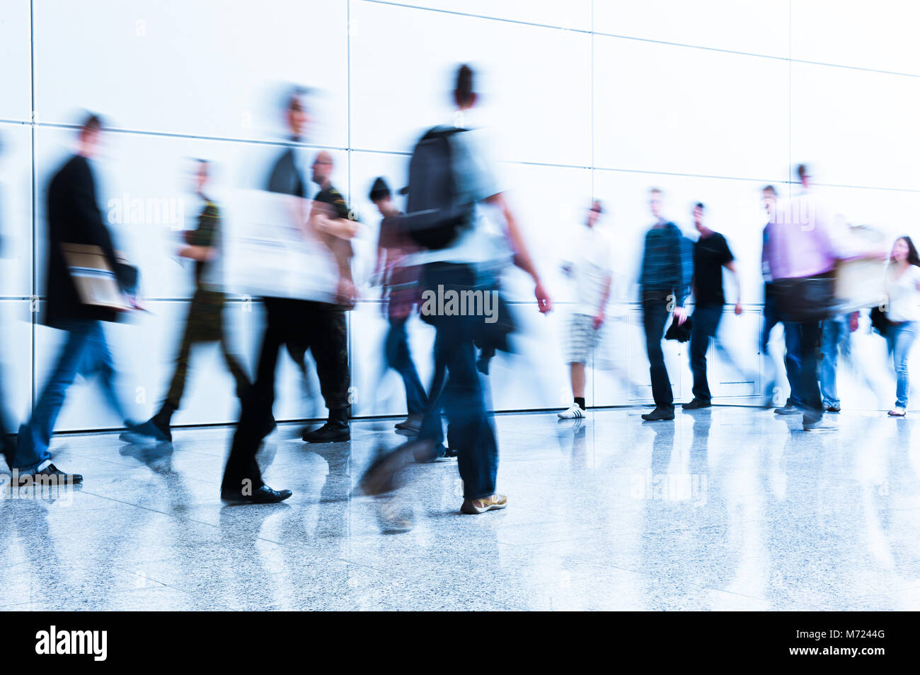 blurred people at a trade fair hall Stock Photo - Alamy