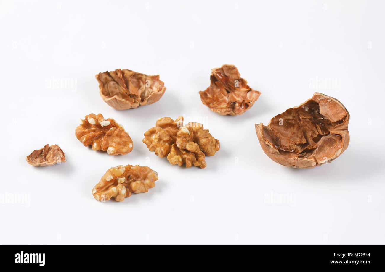 walnut kernels and shells on white background Stock Photo - Alamy