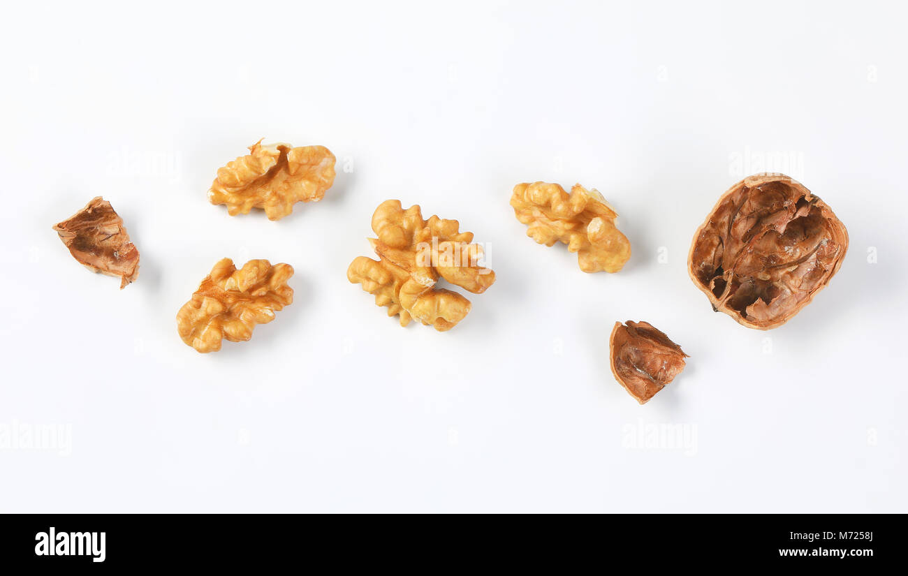 walnut kernels and shells on white background Stock Photo - Alamy