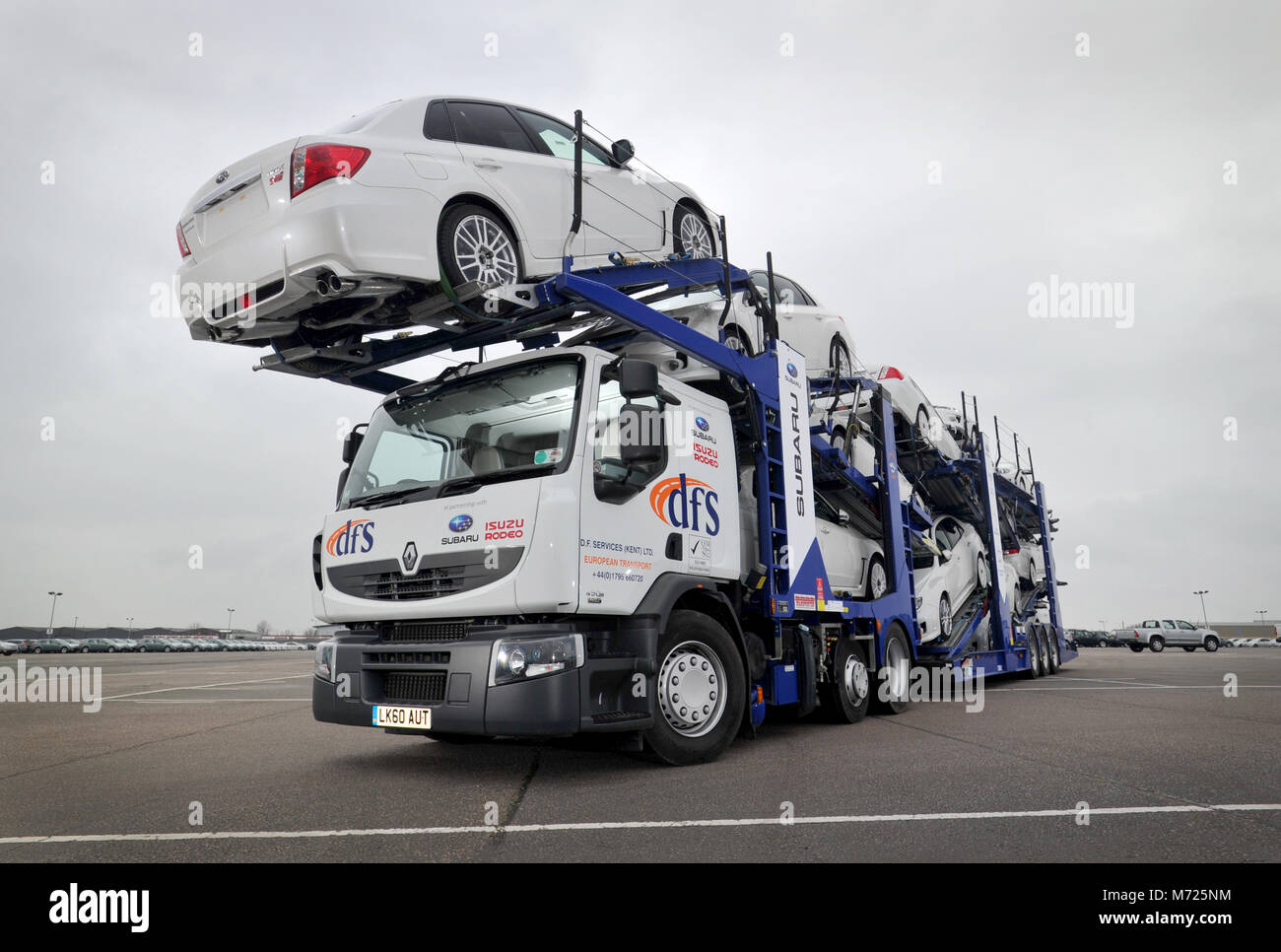 car transporter lorry loaded with new cars Stock Photo - Alamy
