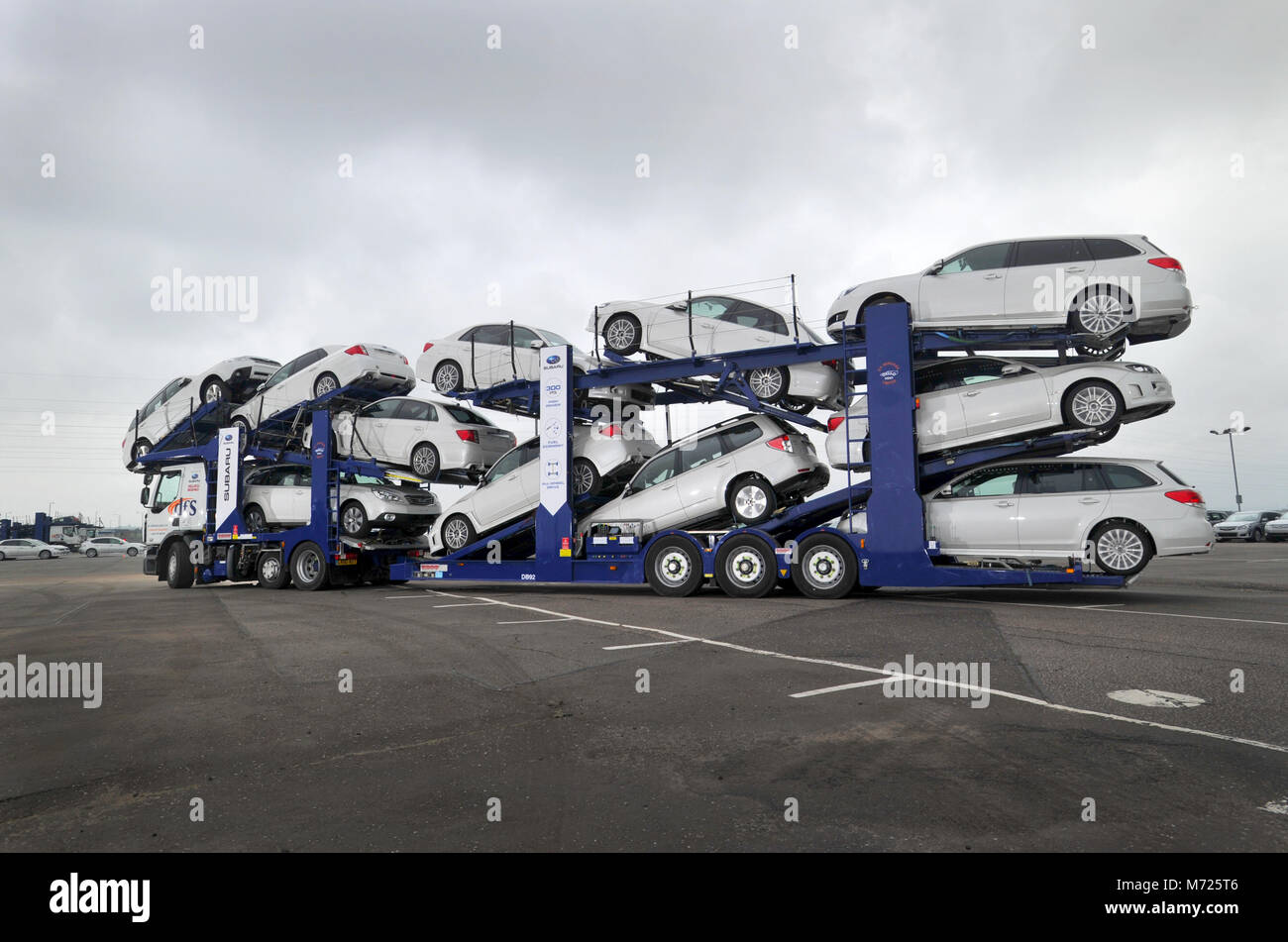 car transporter lorry loaded with new cars Stock Photo - Alamy