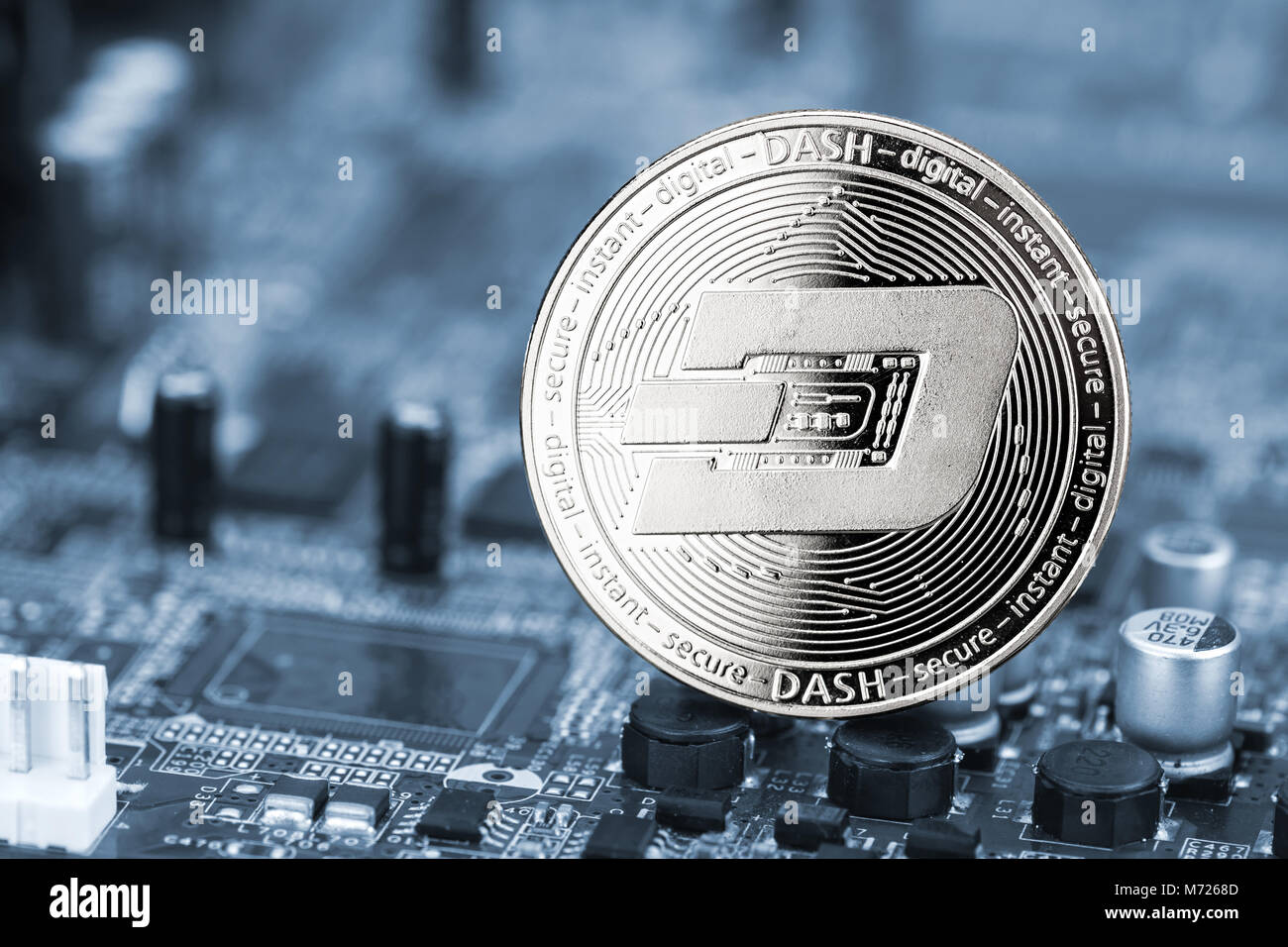 dash silver coin on blue motherboard chip digital mining computer ...