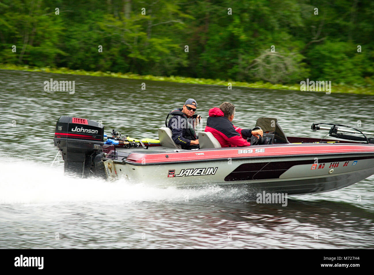 Two men in Red and White Speed boat on River Stock Photo - Alamy