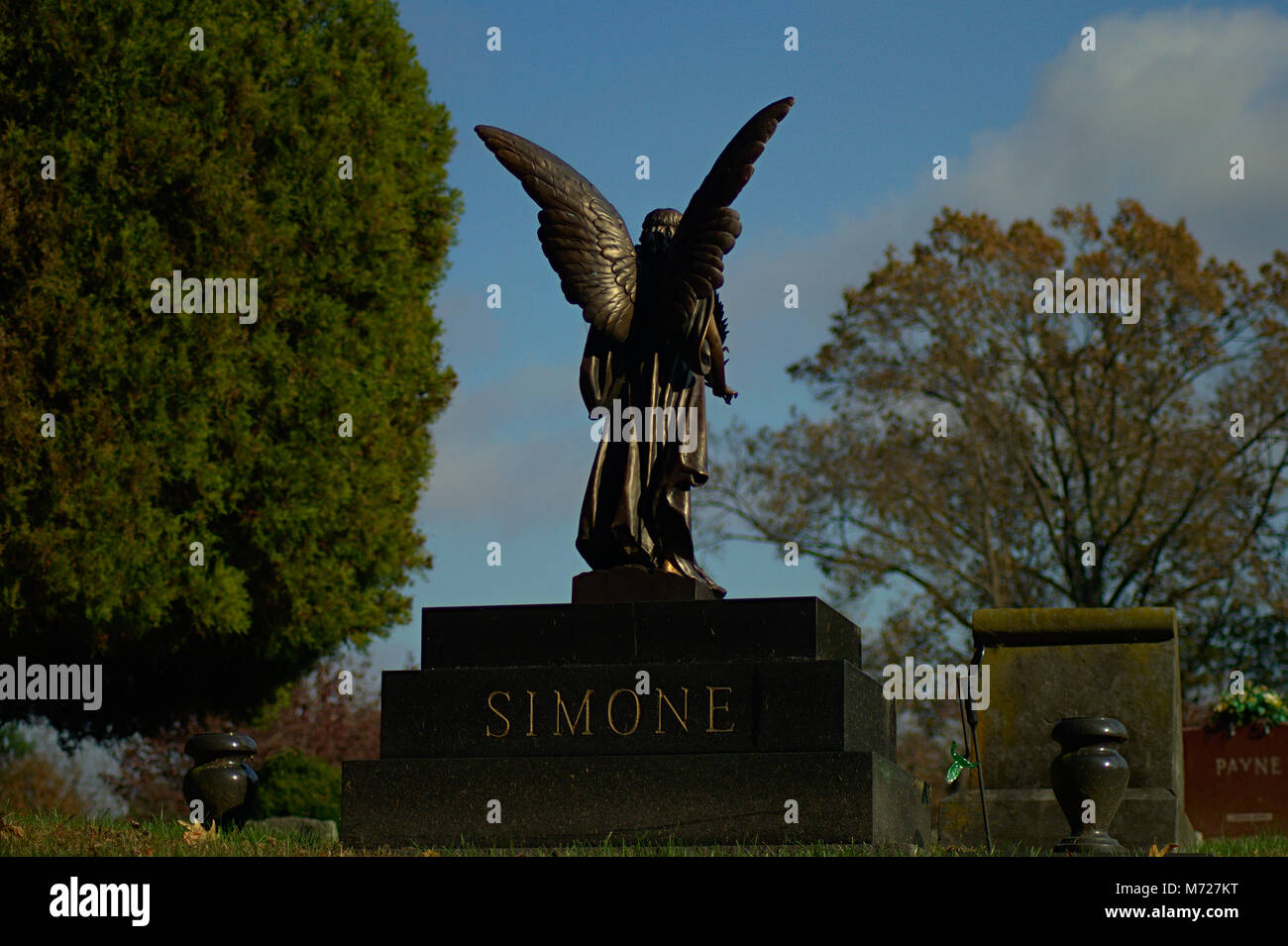 Cemetery headstone with wings Stock Photo - Alamy