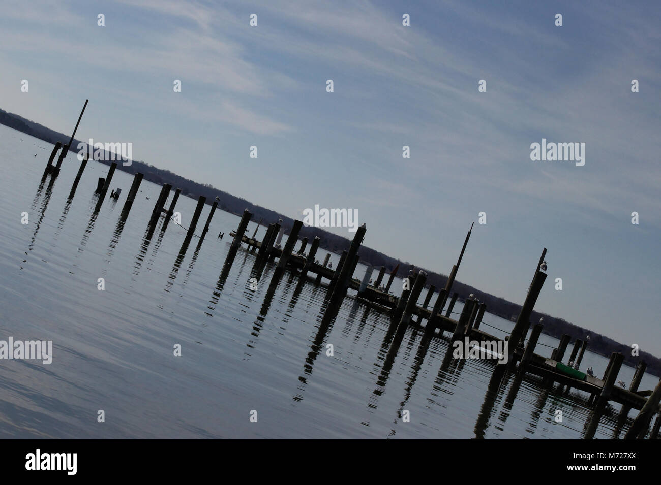 Weathered dock post in coastal water Stock Photo - Alamy