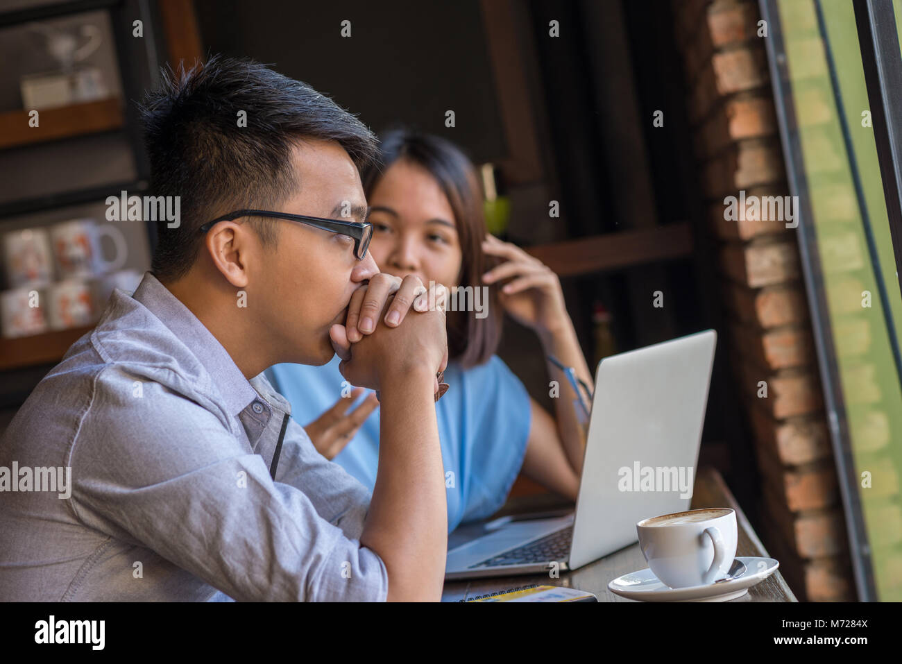 Asian business people thinking about new ideas Stock Photo - Alamy