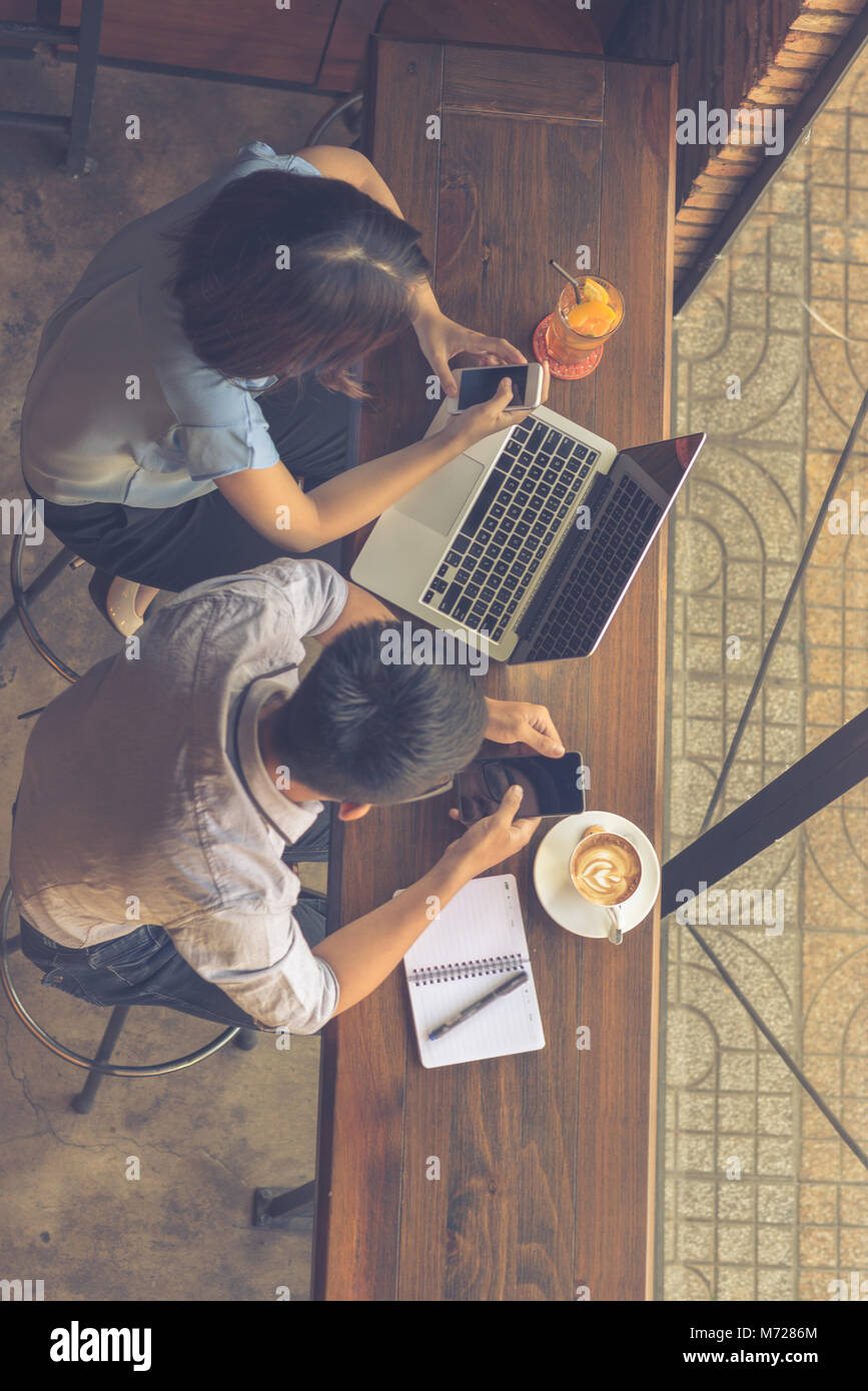 Office employees using smart phone for work Stock Photo - Alamy