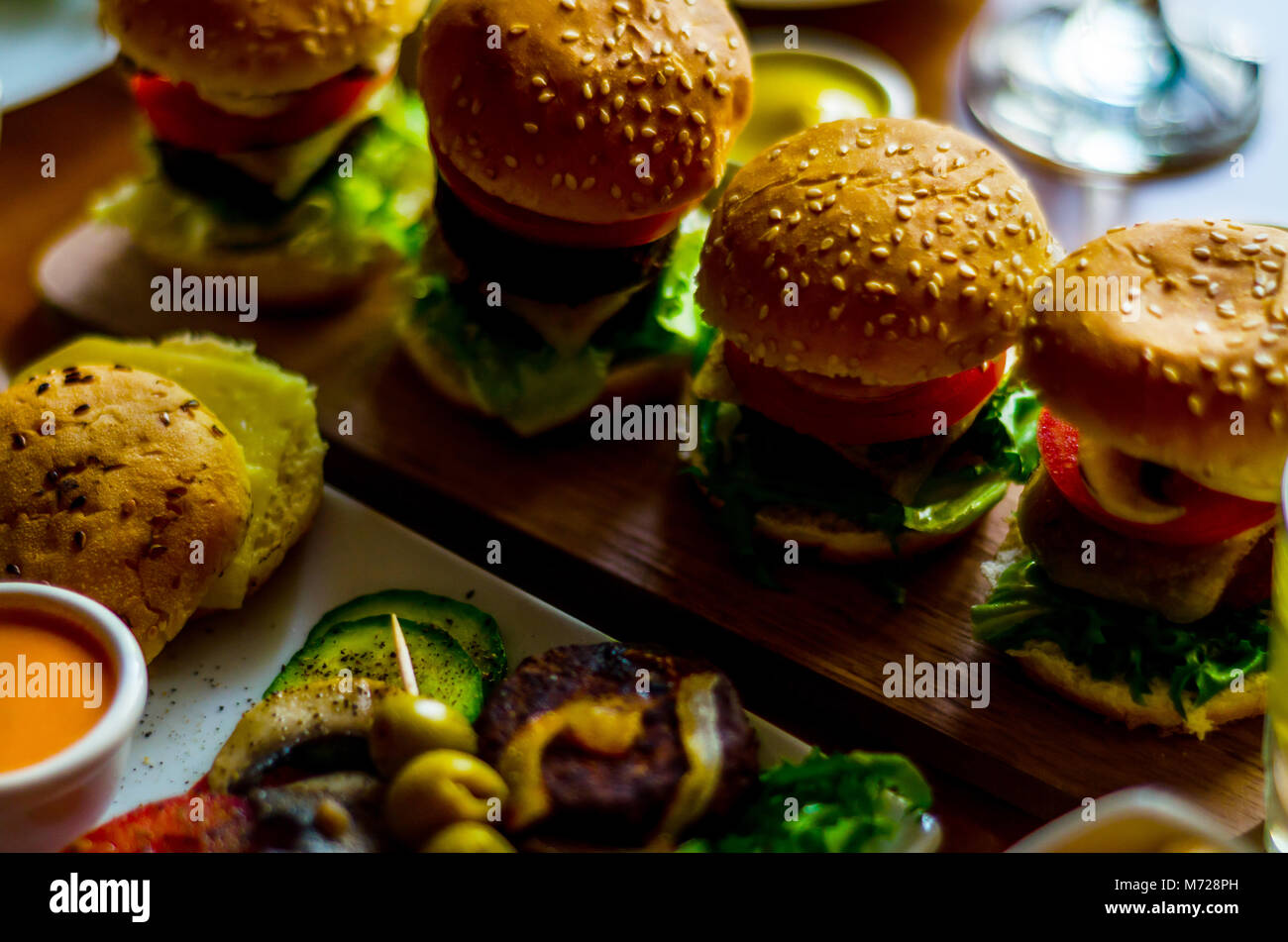 mini burgers with meat, vegetables, cheese and other toppings, bread ...
