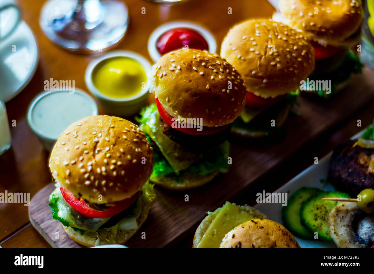 mini burgers with meat, vegetables, cheese and other toppings, bread ...