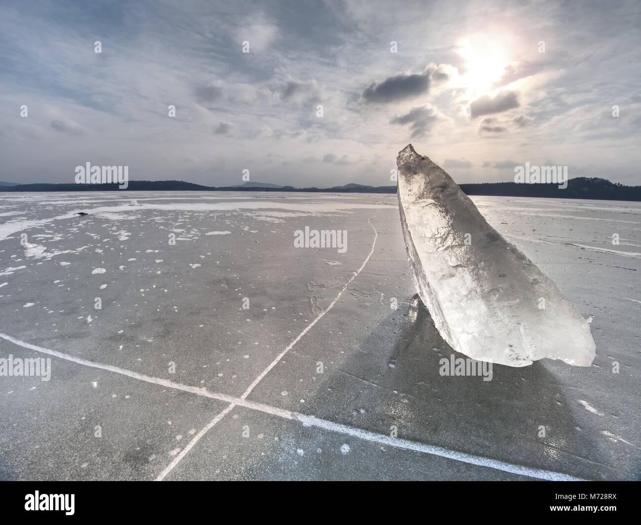 Broken piece of ice with sharp cracks inside. Abstract ice floe. Nature ...