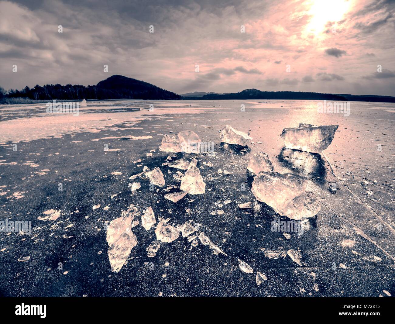 Shining broken ice. Abstract still life of ice floes. Wind, temperature ...