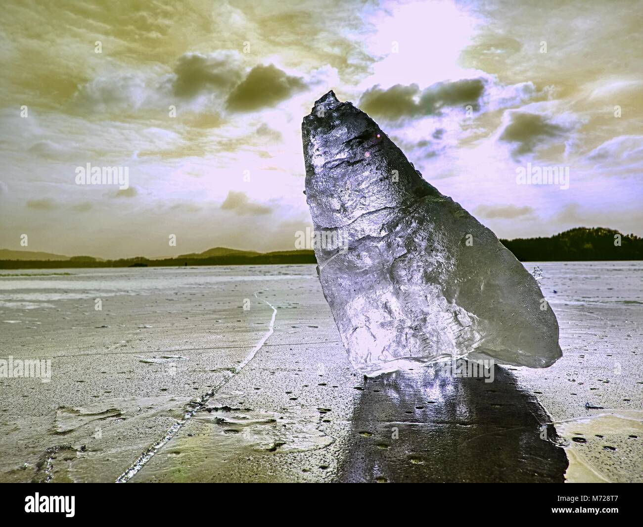 Broken piece of ice with sharp cracks inside. Abstract ice floe. Nature ...