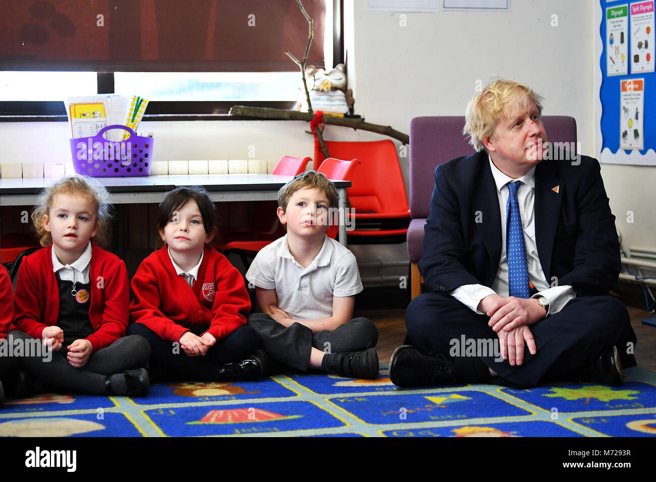 Foreign Secretary Boris Johnson sits with Year 1 pupils from the ...