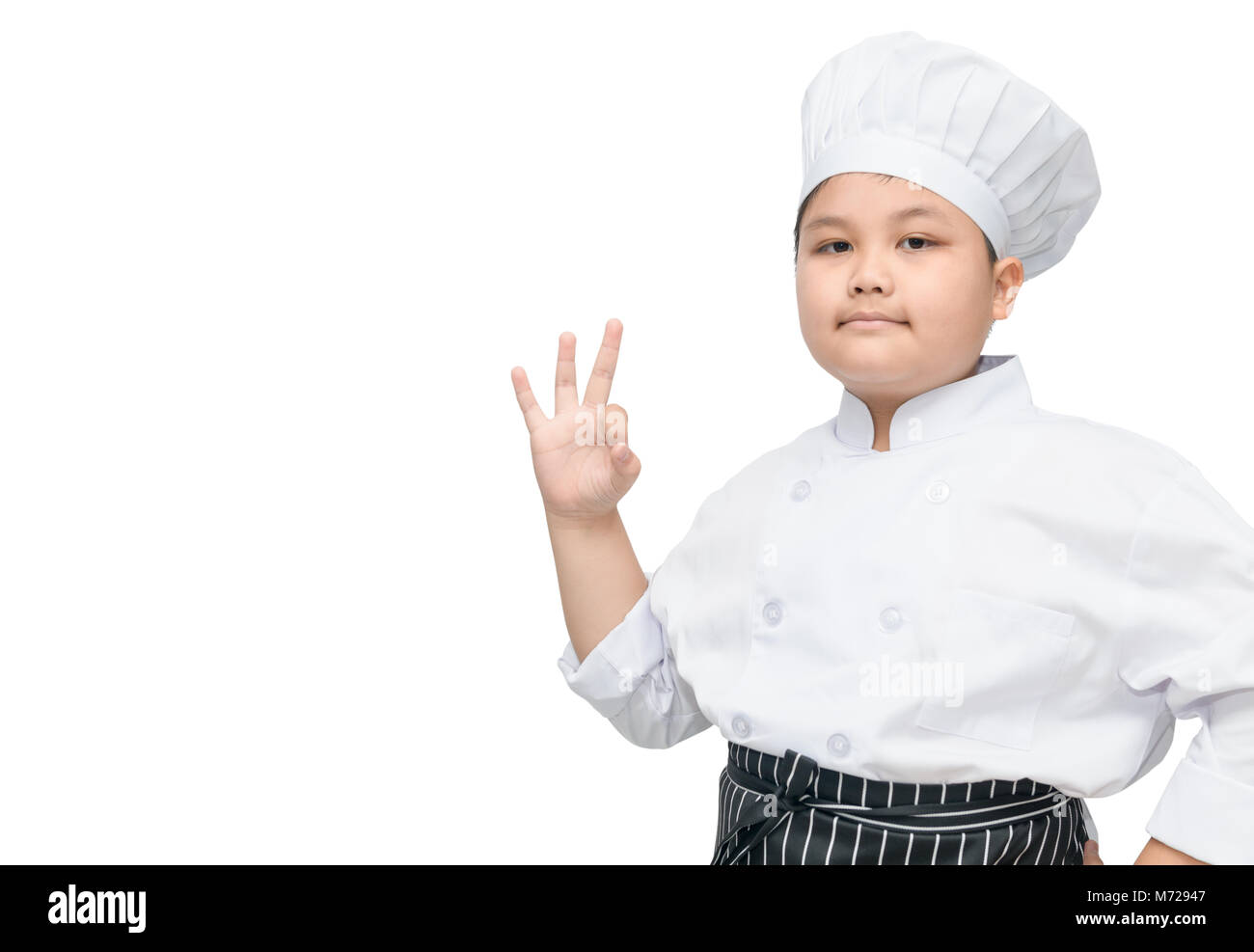 Portrait of fat boy chef cook showing ok sign with cook hat and apron ...