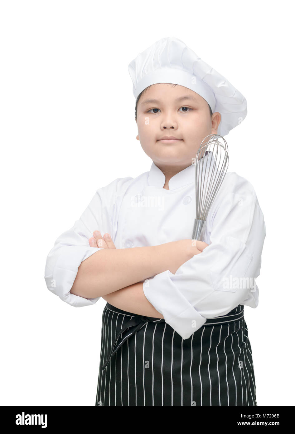 Portrait of cute boy chef hold whisk with cook hat and apron stand and ...