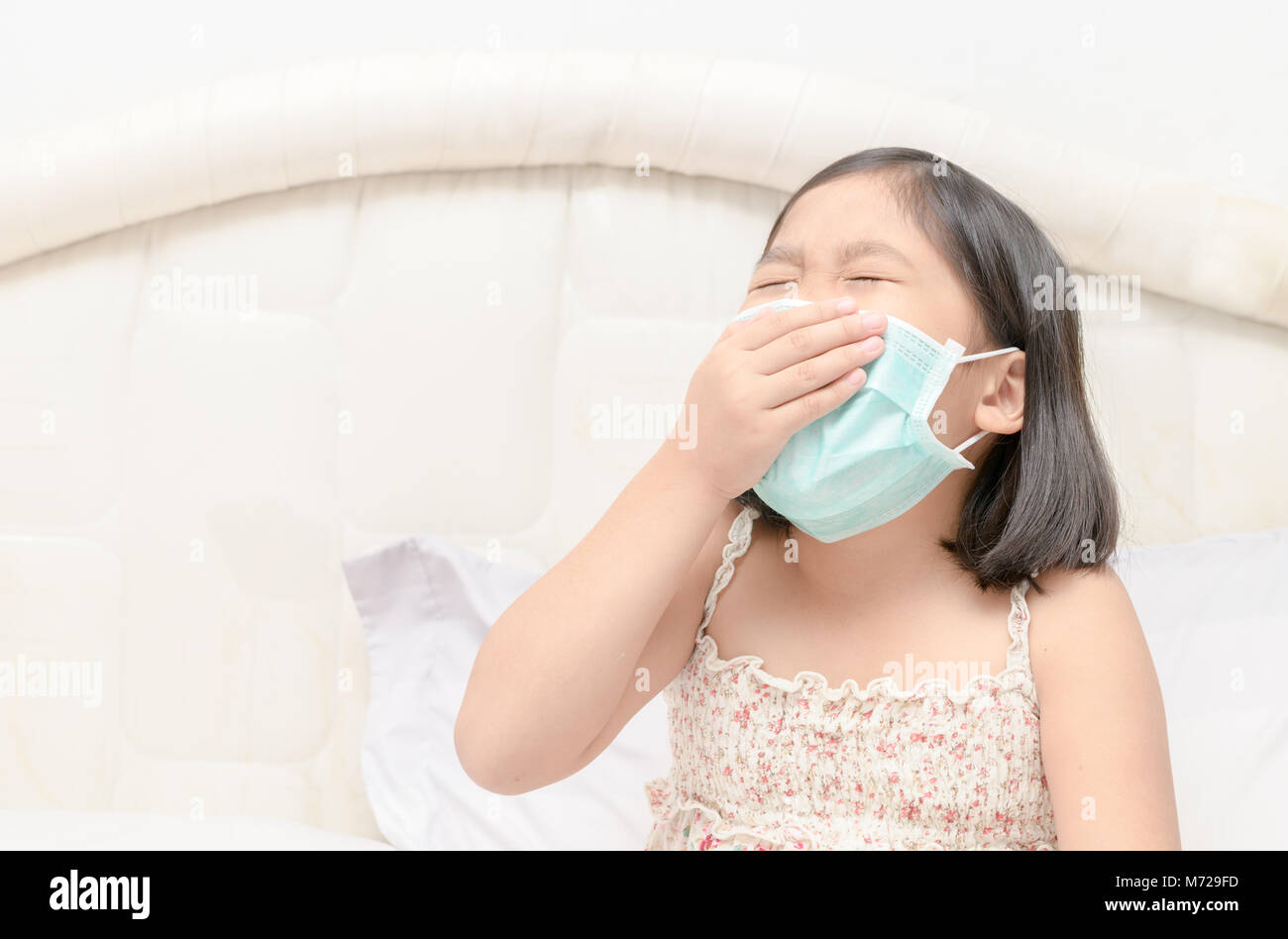 sick girl wear protection mask to protect against influenza virus and ...