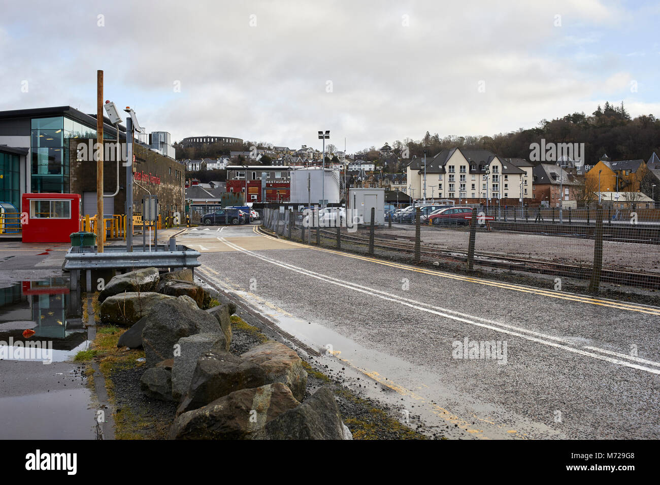 Oban Ferry Terminal building and railway sidings on a damp February ...