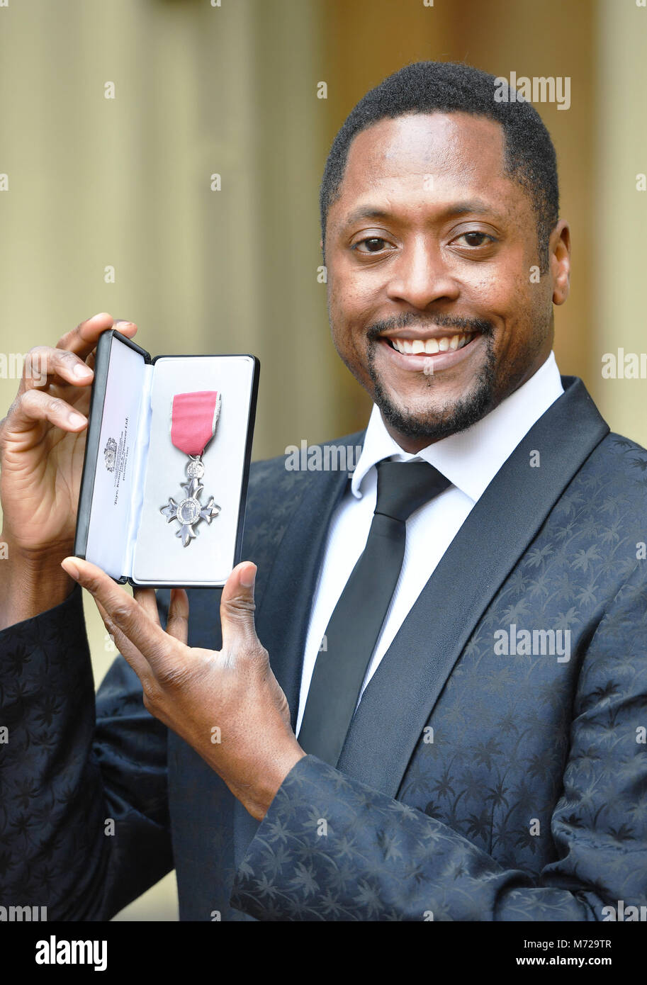 Matthew Henry with his MBE following an investiture ceremony at ...