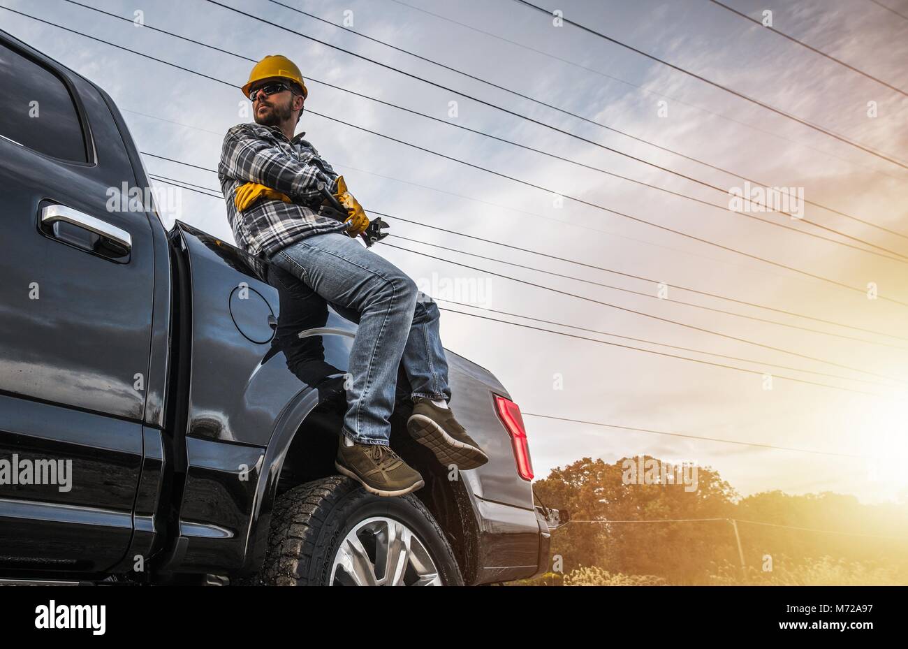Caucasian Construction Worker Relaxing on His Pickup Truck. Freelance ...