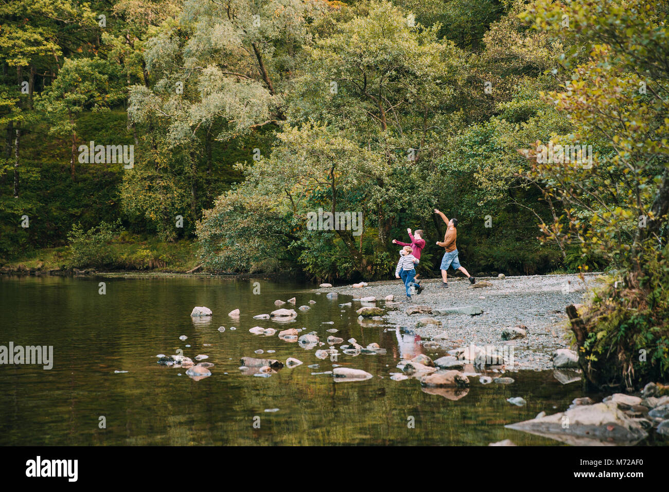 Children throwing stones hi-res stock photography and images - Alamy