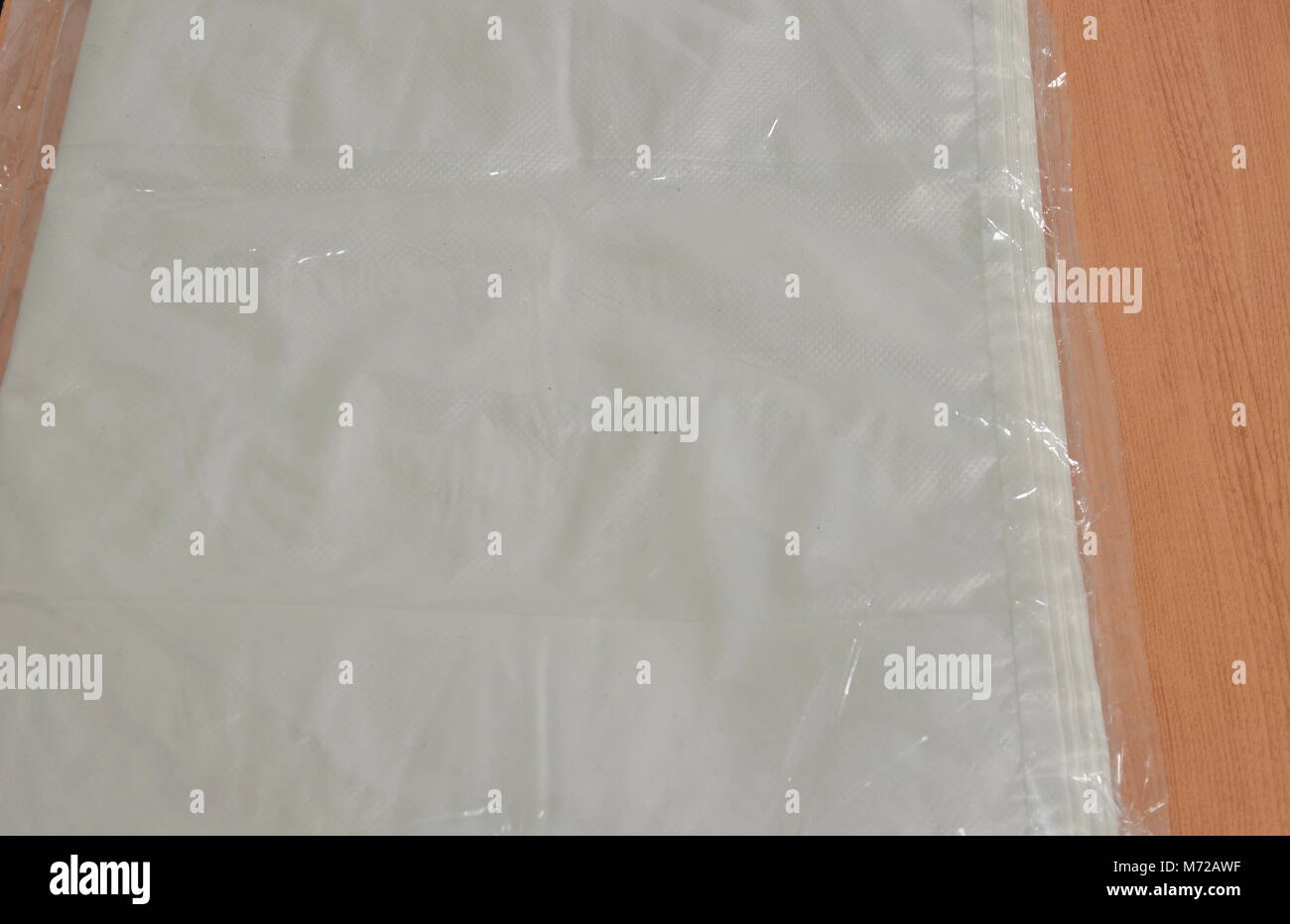 plastic bag packing on table Stock Photo - Alamy