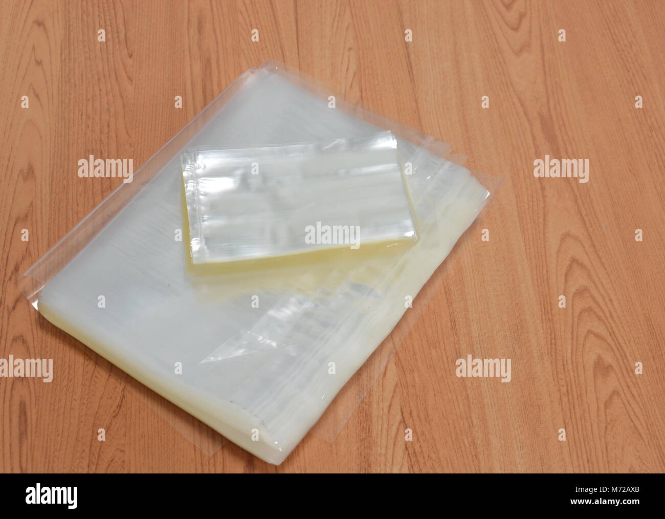 plastic bag packing on table Stock Photo - Alamy
