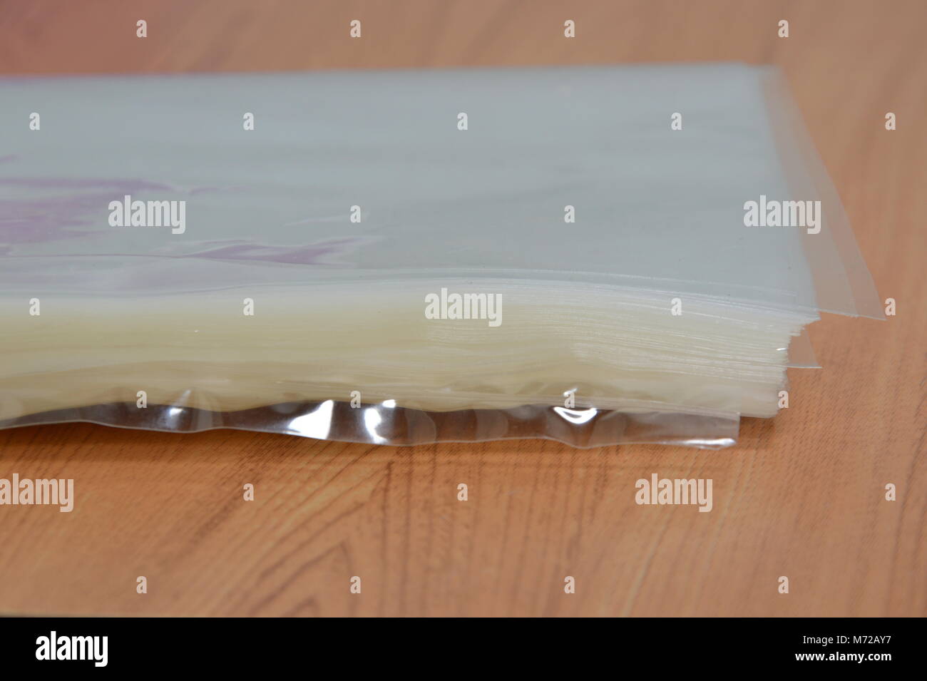 plastic bag packing on table Stock Photo - Alamy