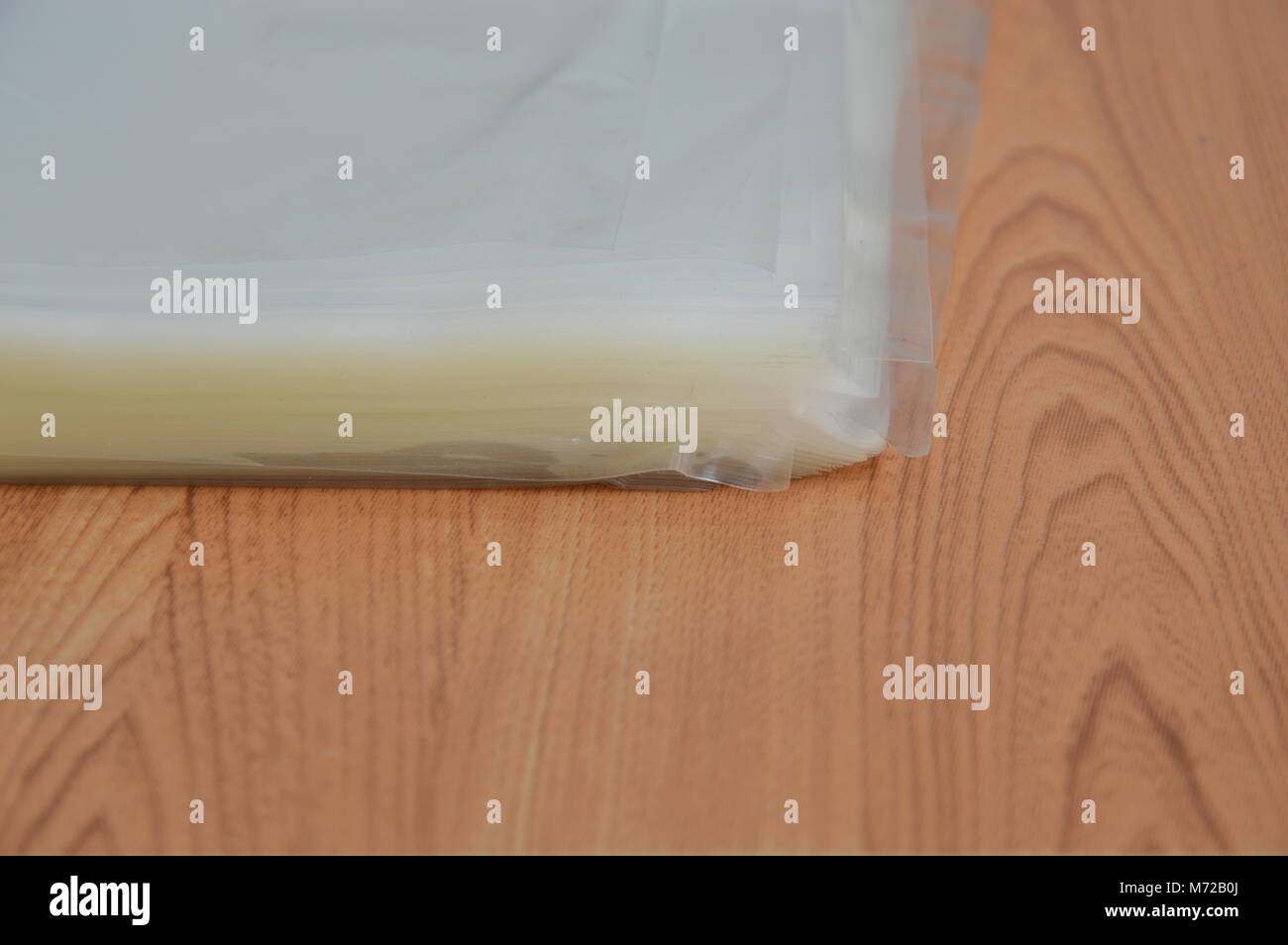 plastic bag packing on table Stock Photo - Alamy