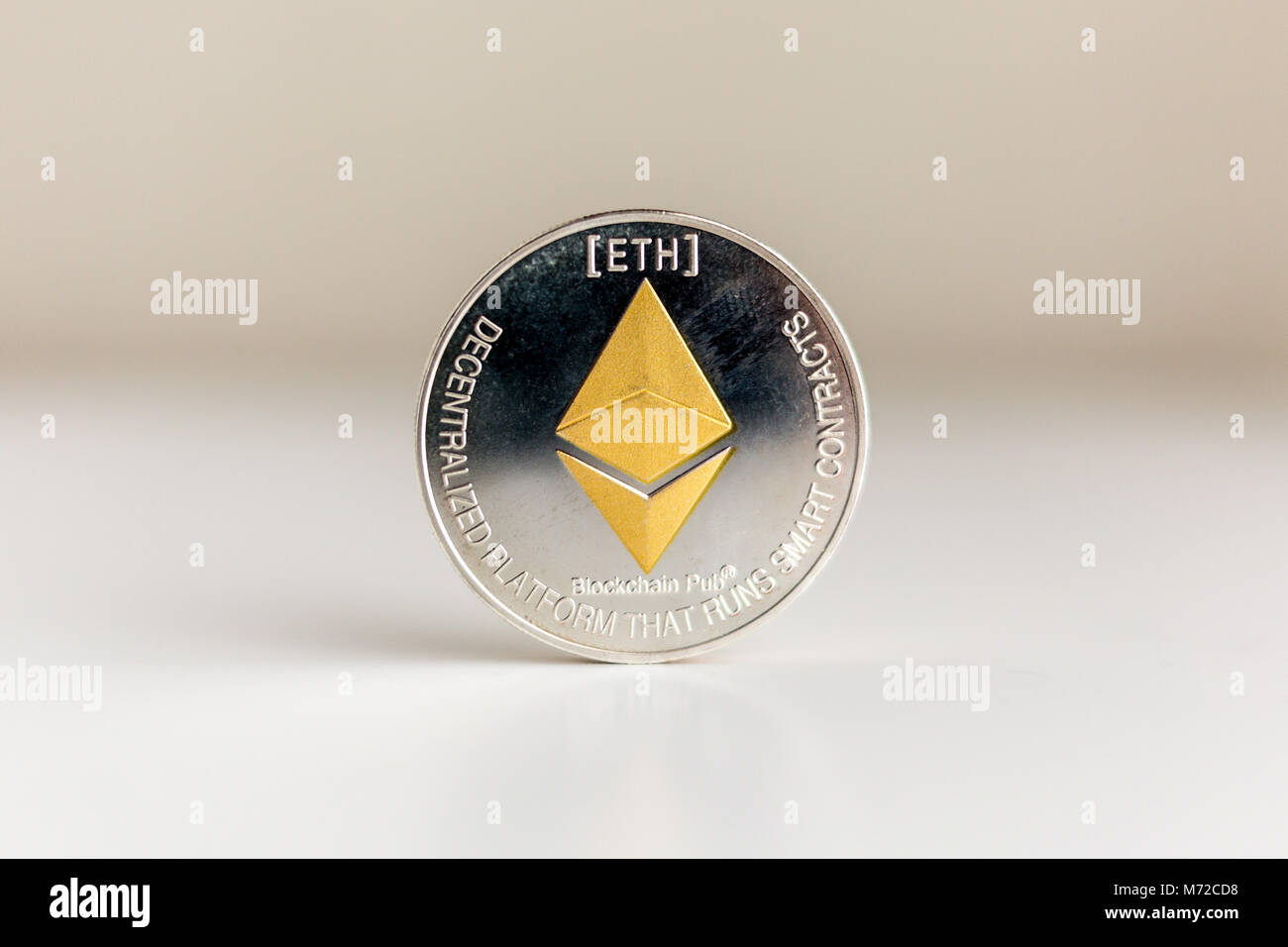 Single ethereum coin on the surface cryptocurrency isolated Stock Photo ...