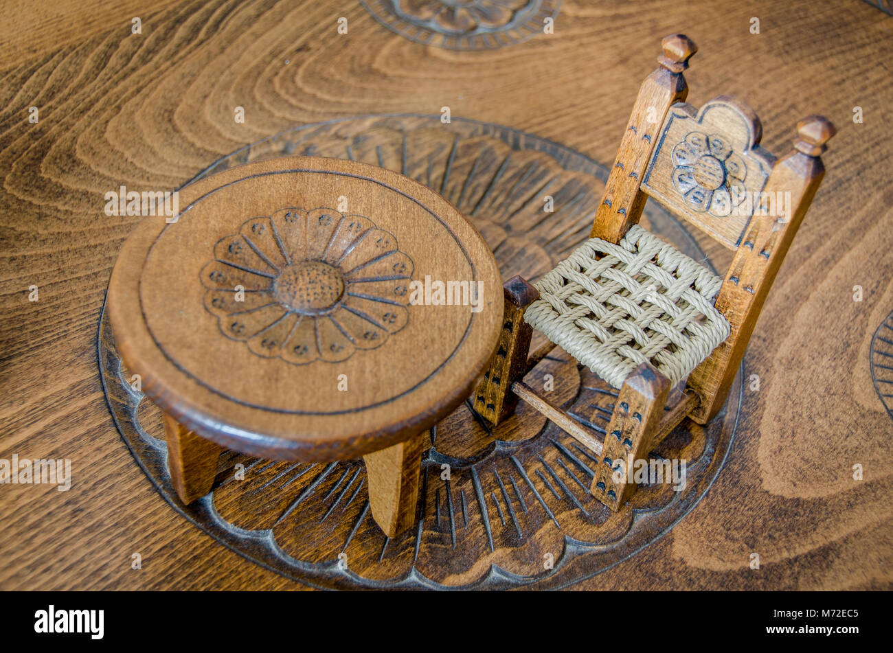 Fine art .Miniature wooden hand made chair and table on carved table ...