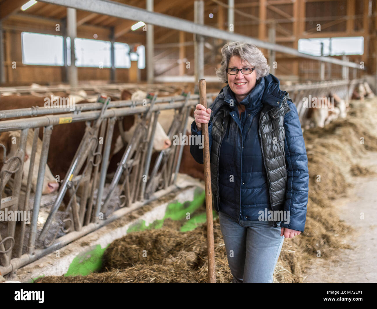 Farmers wife stable work 5 Stock Photo - Alamy