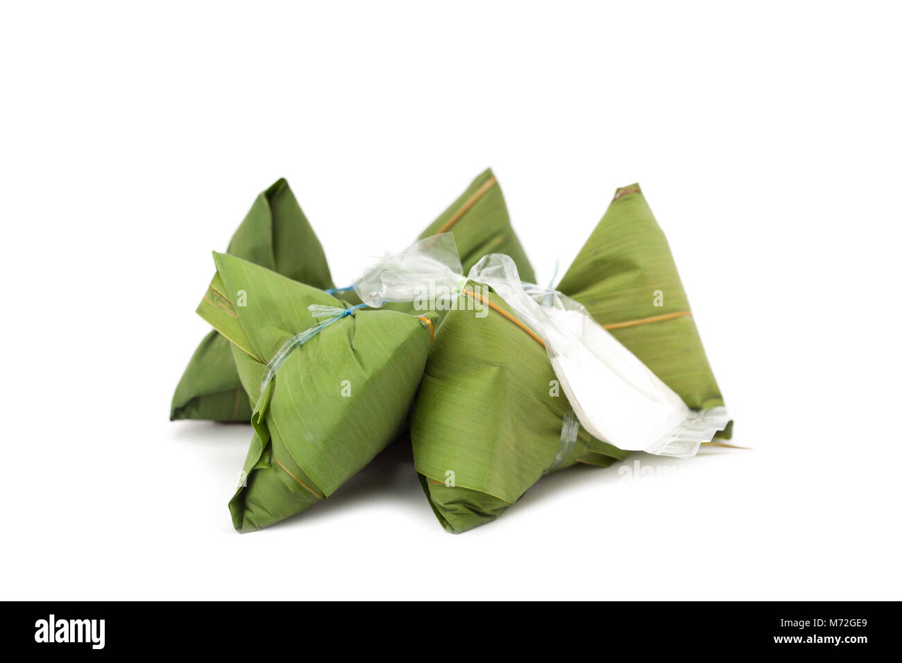 Sticky rice in bamboo leaf with syrup, Thai dessert isolated on white ...