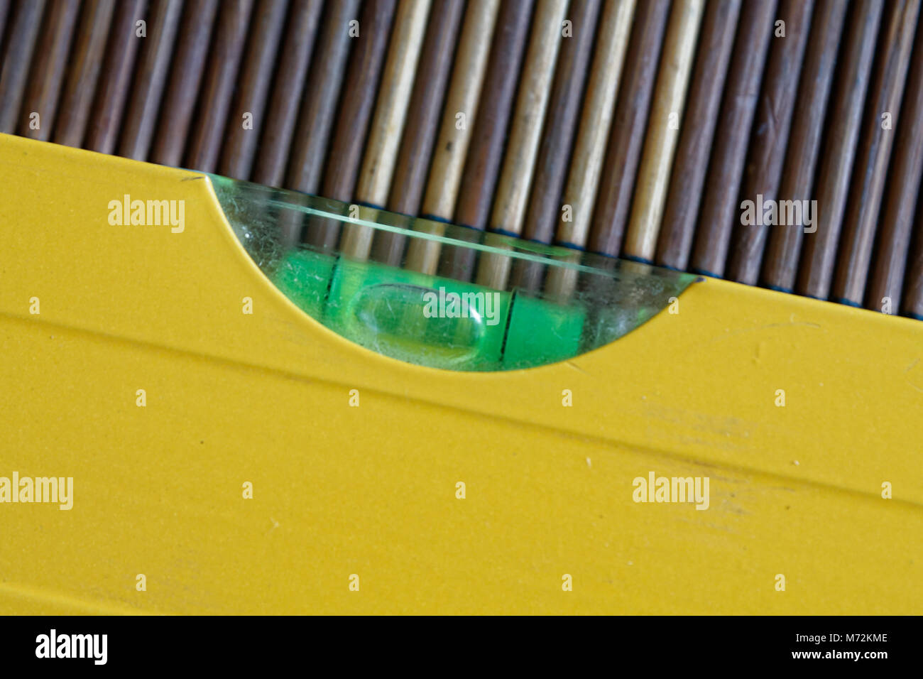 Spirit Yellow level tool close-up, for industrial background or texture ...