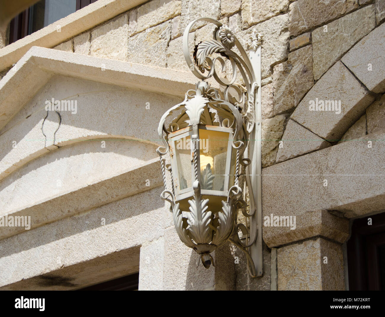 Street lamp on exterior wall of building Stock Photo - Alamy