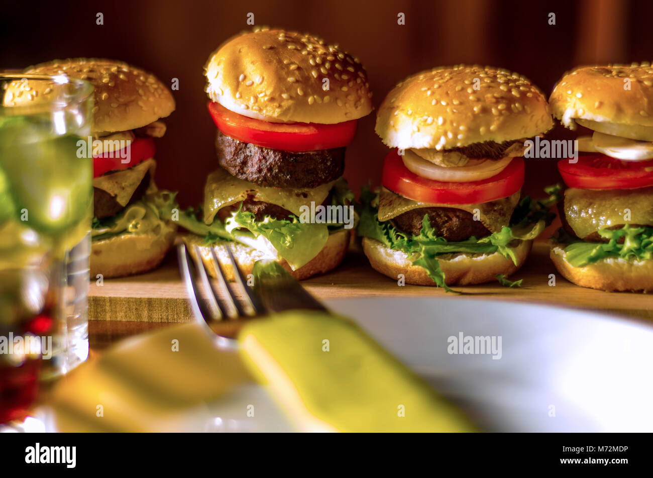 mini burgers with meat, vegetables, cheese and other toppings, bread ...