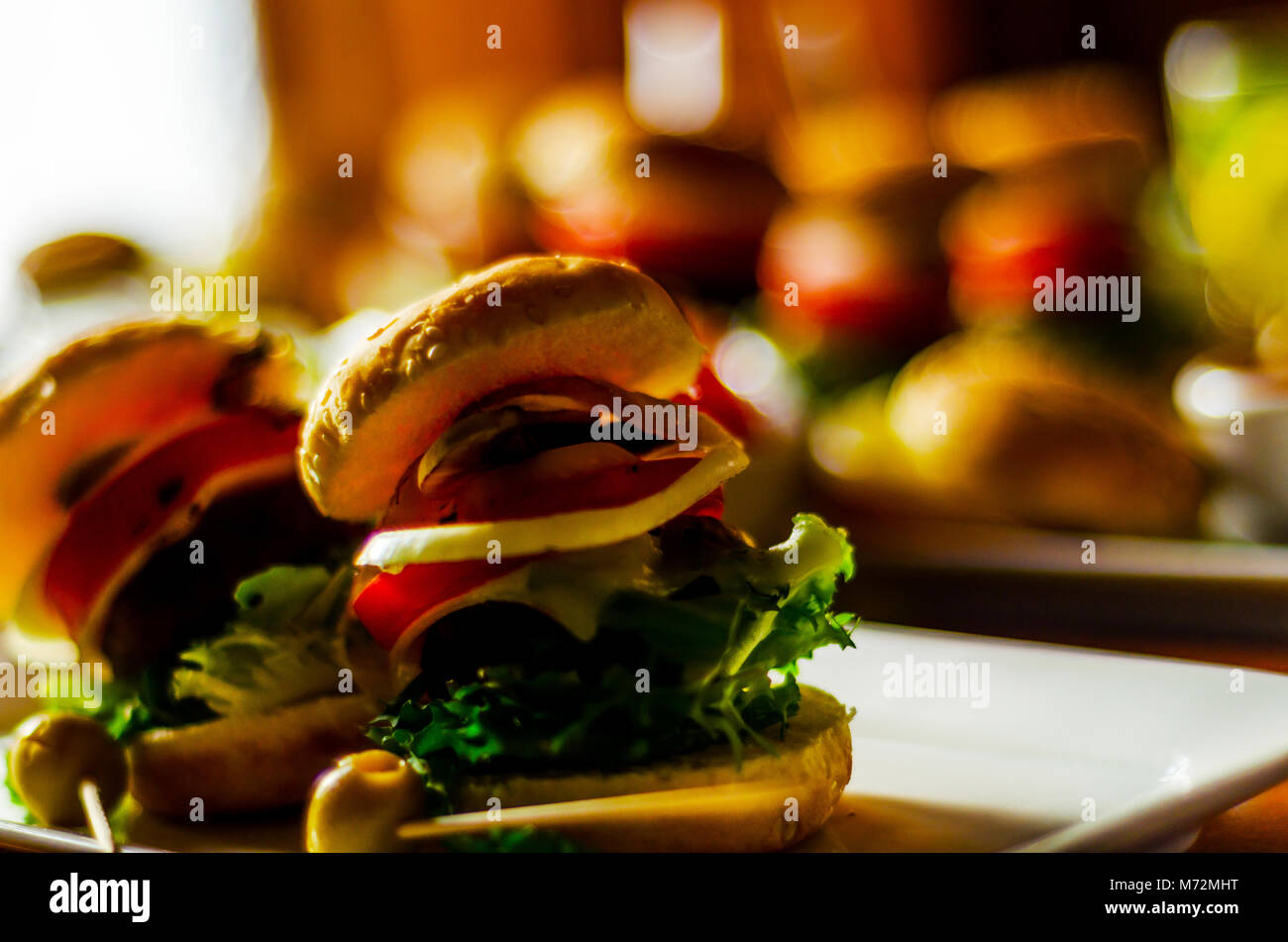mini burgers with meat, vegetables, cheese and other toppings, bread ...
