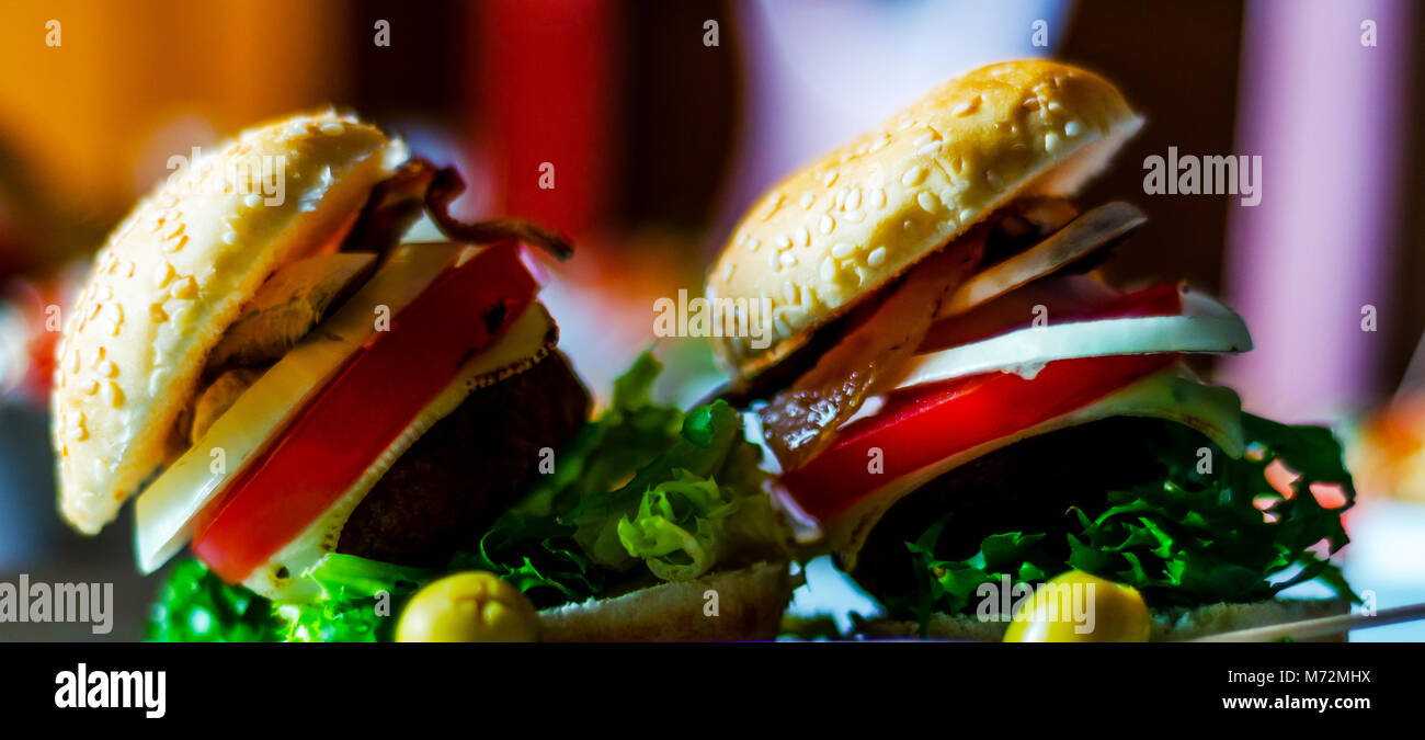 mini burgers with meat, vegetables, cheese and other toppings, bread ...