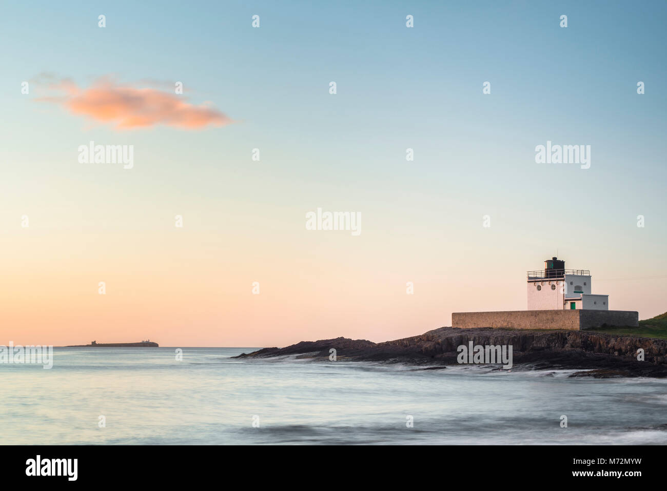 Bamburgh lighthouse on Harkess Rocks, Northumberland, England Stock ...