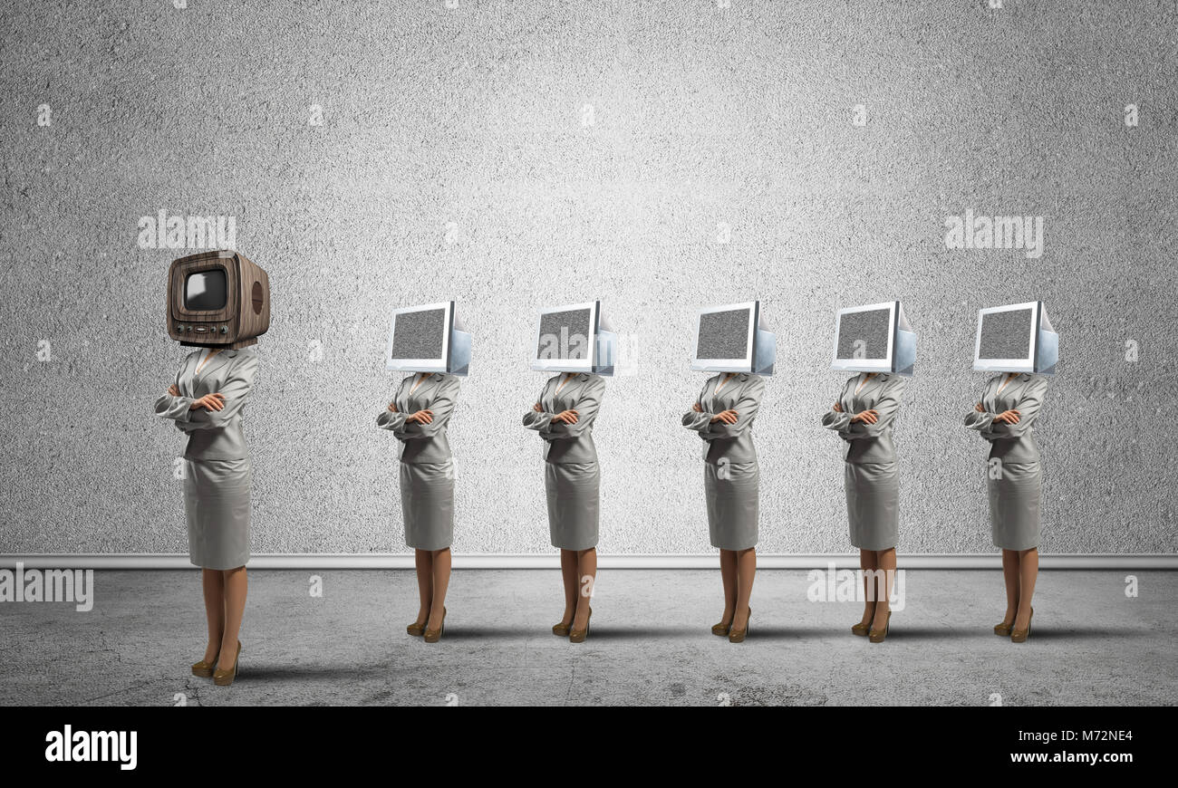 Business women in suits with monitors instead of their heads keeping ...