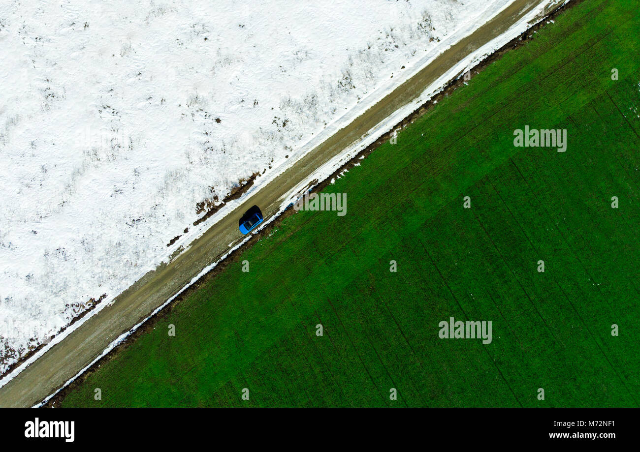 winter and spring field, concept of seasonal change. Aerial view of ...