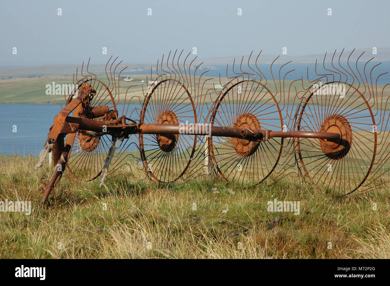 An old wheel rake on Shtland Stock Photo - Alamy