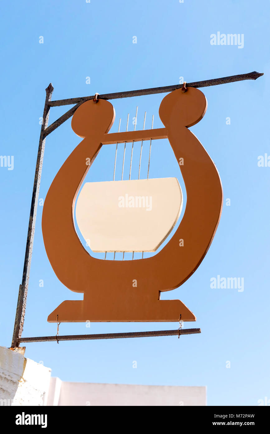 Hanging out label of wooden brown painted lyre. Musical symbol Stock ...