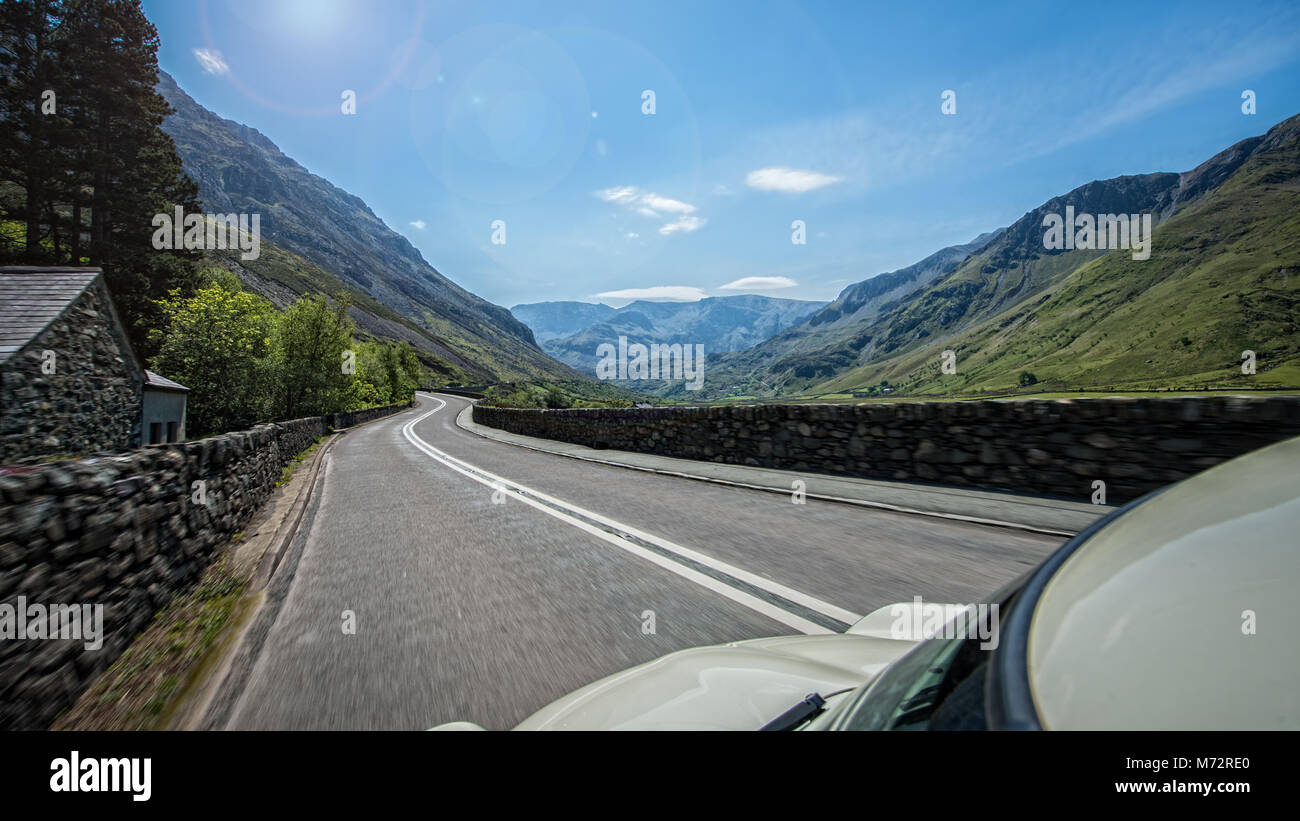 Mini Driving along Mountain Road in Wales Stock Photo - Alamy