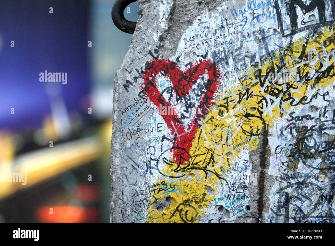 Heart symbol sprayed on the remnant of the Berlin Wall, which has been ...